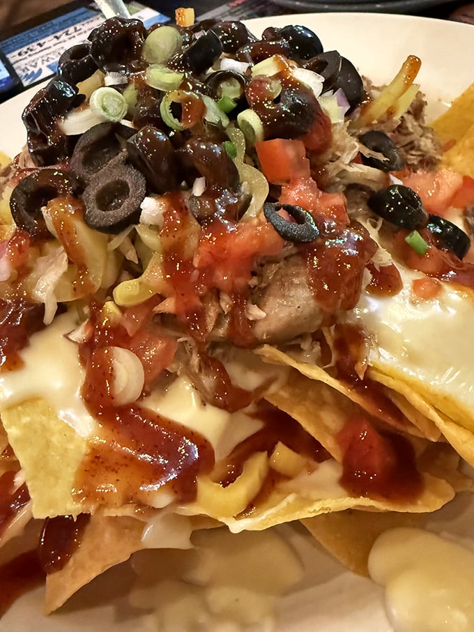 The legendary Nacho Grande – a mountain of crispy chips, melted cheese, and toppings that makes other nachos look like they're not even trying.