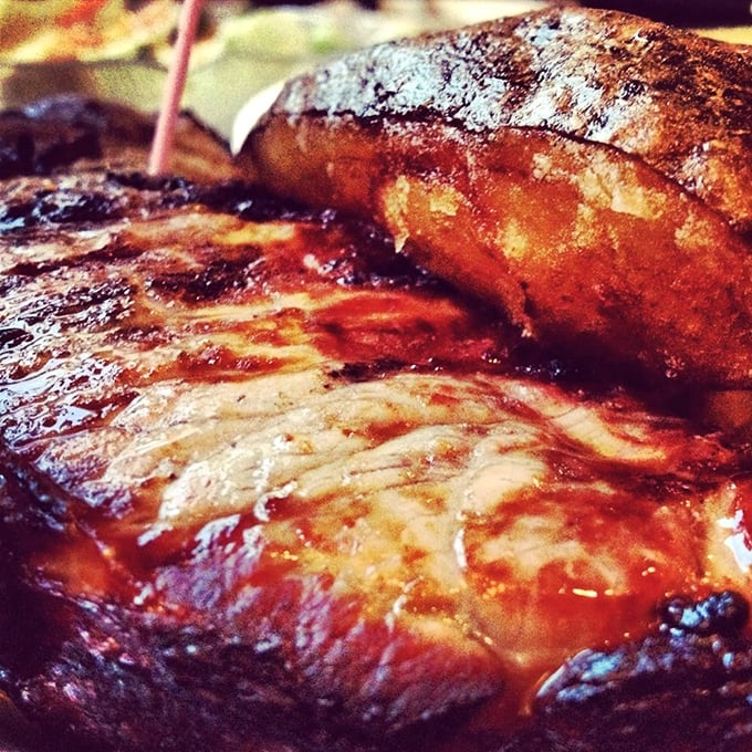 When a steak glistens like this, it's not just dinner—it's performance art. The sear on this beauty would make even vegetarians pause.