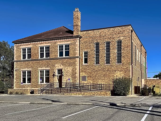 This handsome brick building whispers stories of civic pride from an era when public architecture was meant to inspire, not just house paperwork.