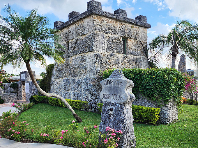 "ADM. 10¢ DROP BELOW." Inflation has changed the price tag, but the castle's stone guardians remain steadfastly unchanged by time.