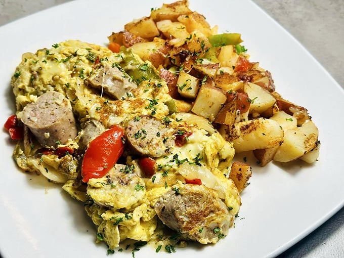 Eggs and sausage performing a perfect tango with herbs and potatoes. This isn't breakfast – it's edible choreography.