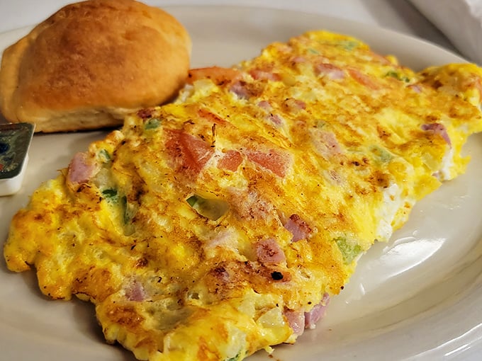 This omelet doesn't need a fancy pedigree—it's the fluffy, cheese-laden masterpiece that's worth driving across county lines for at 7am on a Tuesday.