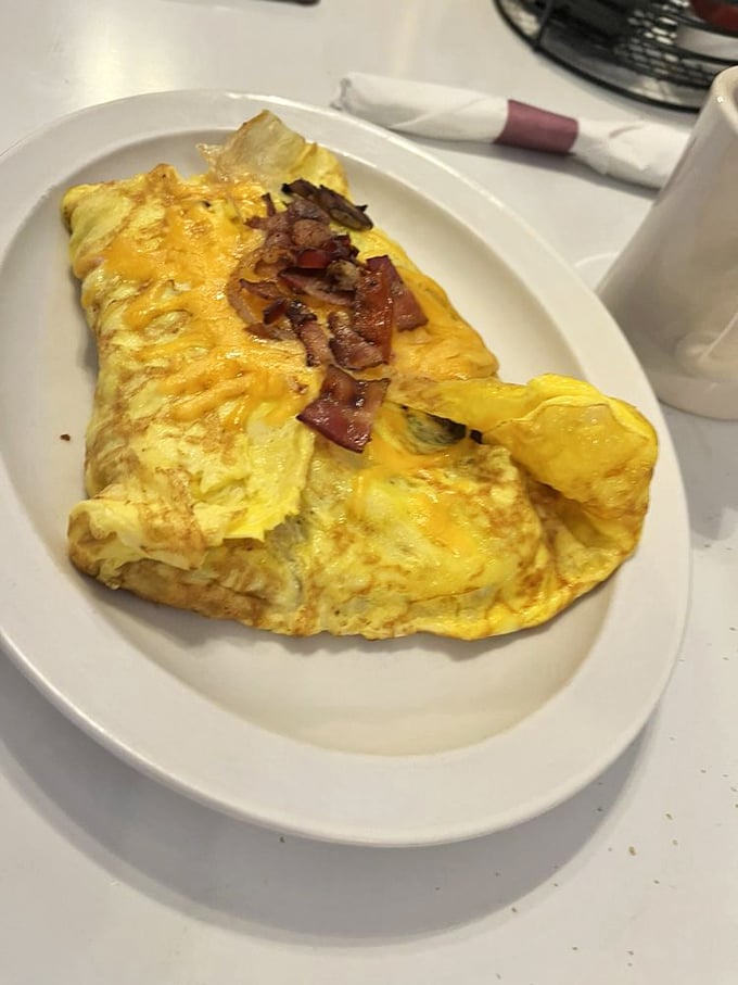 The legendary omelet that launched a thousand road trips. Perfectly folded, generously filled, and capable of curing whatever ails you.