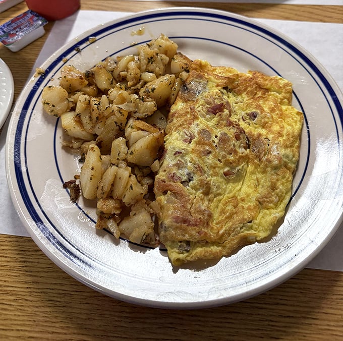 This golden omelet and seasoned home fries duo isn't playing hard to get—it's the straightforward breakfast romance you've been searching for.
