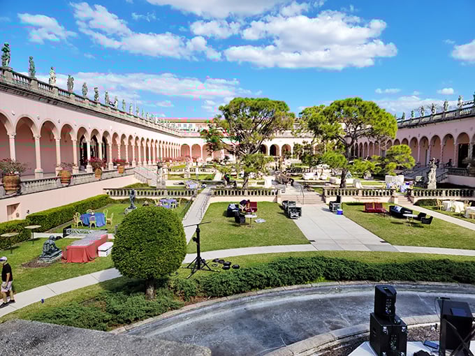 The courtyard garden creates a peaceful oasis where Renaissance-inspired colonnades frame manicured greenery—nature and architecture in perfect harmony.