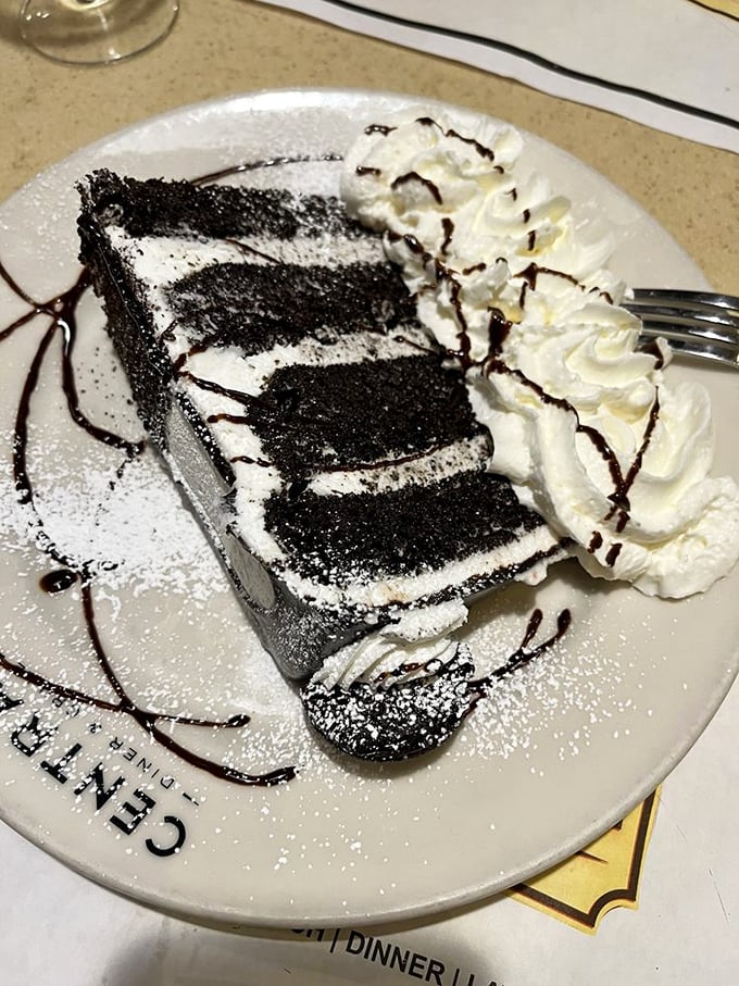 Layer upon layer of chocolate decadence with whipped cream standing by for moral support. This isn't just cake; it's therapy without the hourly rate.
