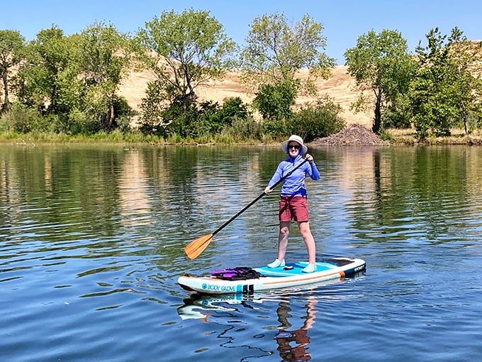 Paddle boarding: where serenity meets core strength. Lake Oroville offers glass-like waters perfect for beginners and experts alike—no ocean waves or sharks to worry about!