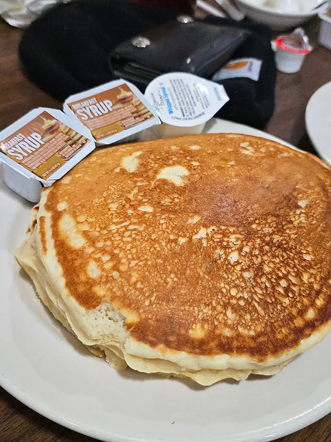 Behold the pancake that launched a thousand road trips. Golden-brown, perfectly cooked, and large enough to make you question your decision to order a stack.