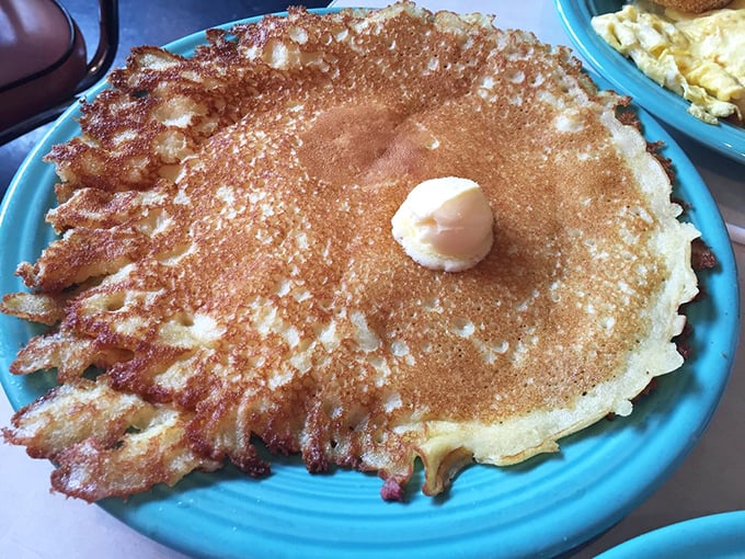 Behold the famous hotcake in its natural habitat—crispy-edged, butter-crowned, and ready to ruin all other pancakes for you forever.
