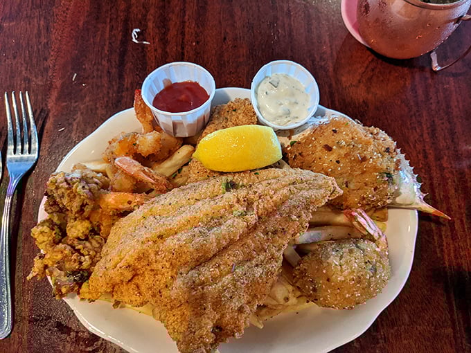 The seafood platter arrives like a greatest hits album—golden-fried treasures that make you wonder why you ever eat anything else.