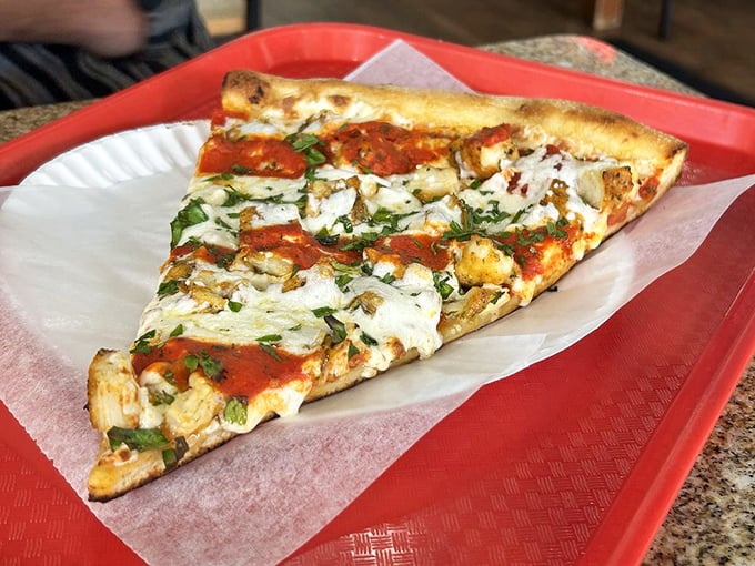 This isn't just a slice—it's edible architecture with layers of flavor that would make Frank Lloyd Wright put down his blueprints and pick up a fork.