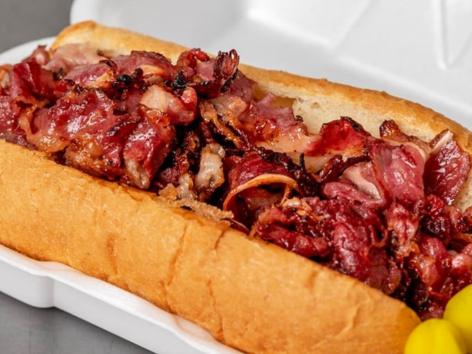 This isn't just pastrami—it's a mountain of thinly-sliced, perfectly seasoned meat that makes Manhattan delis nervously look over their shoulders.