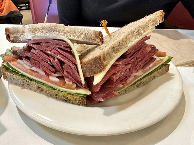 This isn't just a sandwich—it's an architectural marvel of perfectly stacked pastrami, the meat-to-bread ratio that dreams are made of.