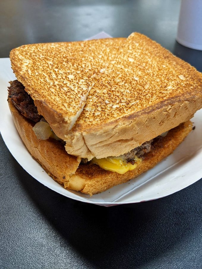 The legendary patty melt—perfectly grilled bread embracing a juicy beef patty and melted cheese. It's the sandwich equivalent of finding money in an old jacket pocket.