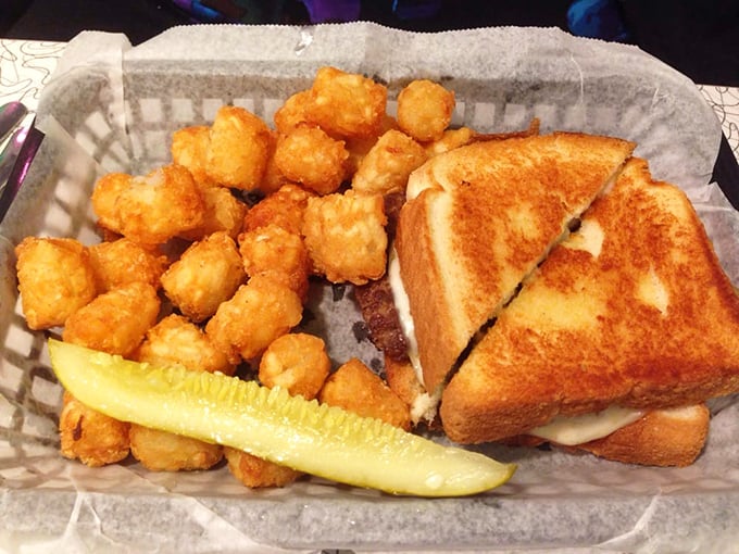 The patty melt arrives like a work of art – golden-brown bread, melty cheese, and those tater tots looking like little nuggets of joy.