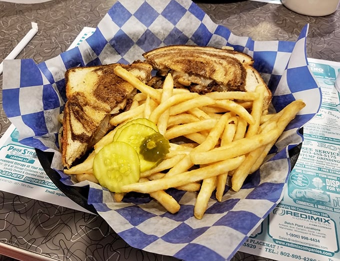 The patty melt—where grilled rye bread, caramelized onions, and melted Swiss create a holy trinity of comfort food perfection.