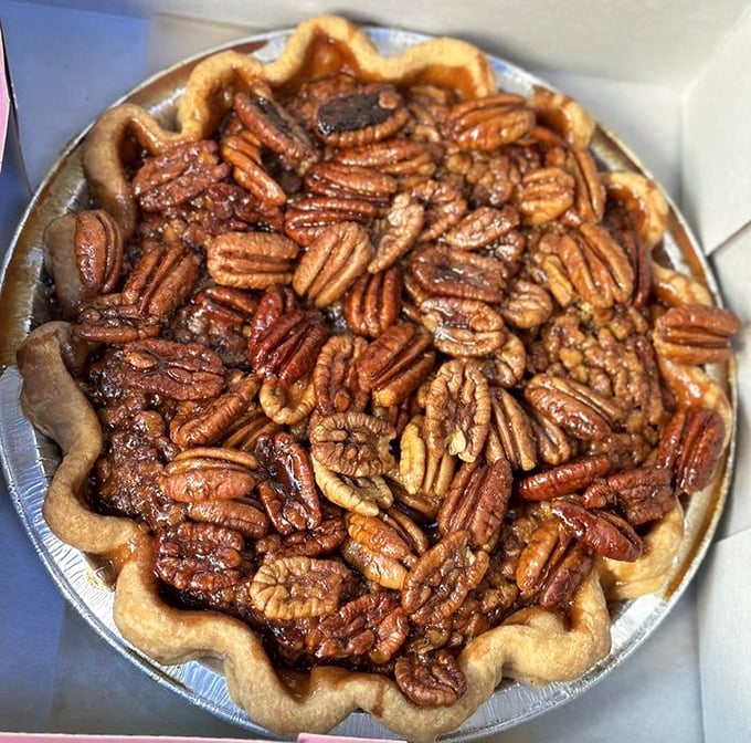 Behold the pecan pie in all its glory! Those perfectly arranged nuts sitting atop that amber filling are basically edible artwork. Michelangelo would weep.