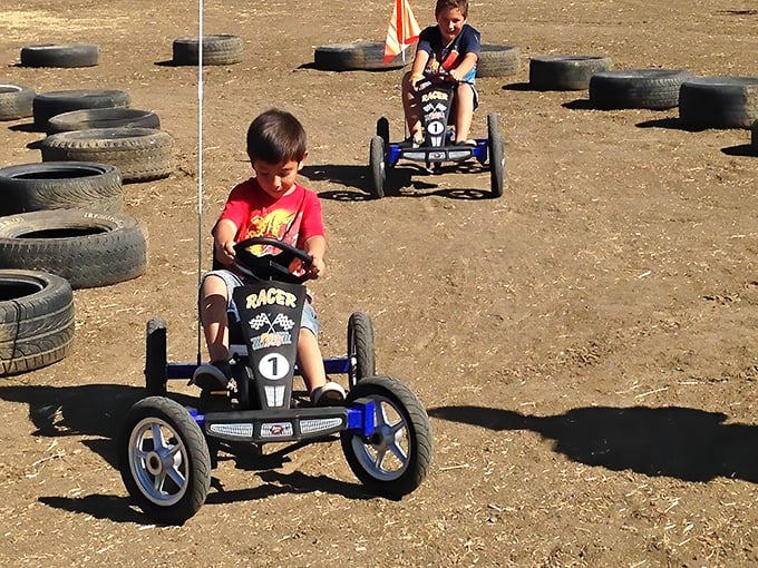 Kids racing pedal karts proves that entertainment doesn't need batteries or Wi-Fi—just good old-fashioned competition and the occasional scraped knee.