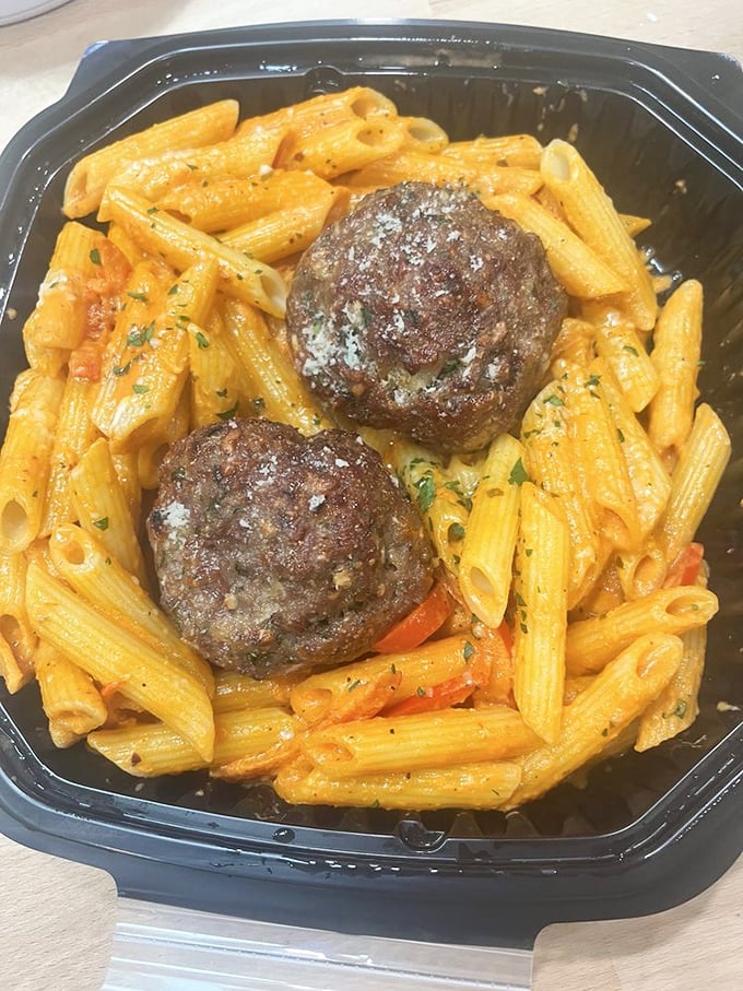 These meatballs don't play hard to get—they're the perfect dance partners for that vibrant vodka sauce coating every ridged penne.
