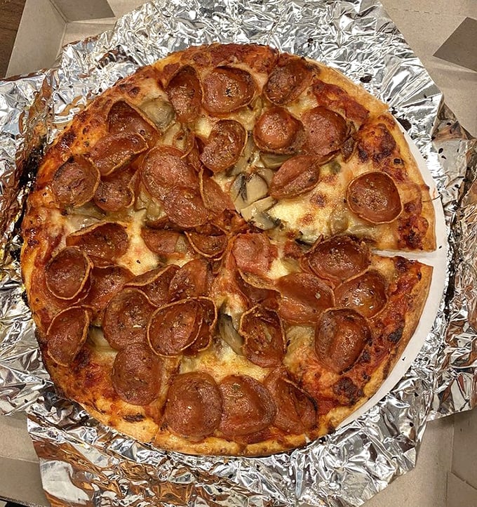 Those curled-up pepperoni cups aren't just toppings—they're tiny flavor reservoirs collecting all the savory goodness pizza dreams are made of.