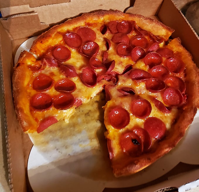 This isn't just pepperoni pizza—it's pepperoni that's having its own little party, curling up into perfect cups of savory goodness. The cheese pull potential is magnificent.