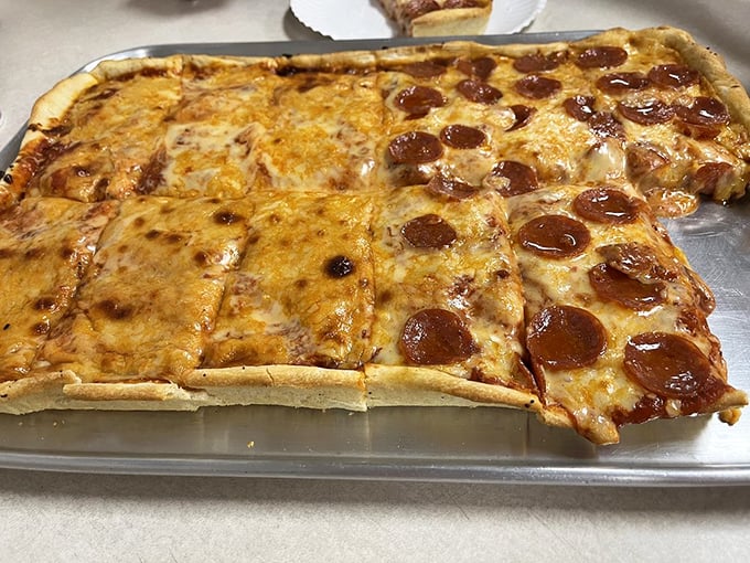 Behold the holy grail of Scranton pizza—crispy-edged pepperoni cups creating little pools of flavor that would make even the most jaded New Yorker weep with joy.