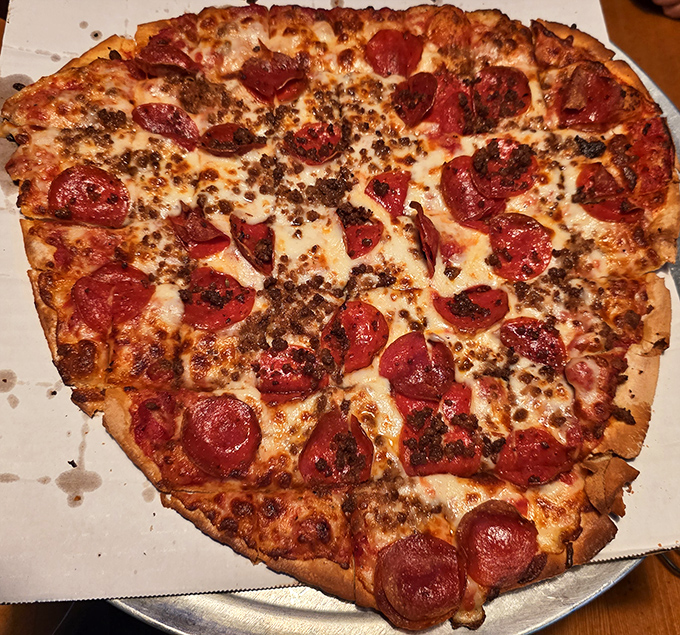 Not all heroes wear capes—some come on a pizza pan with perfectly curled pepperoni cups holding little pools of spicy goodness.