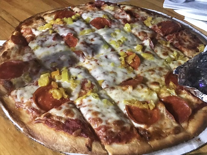 Pepperoni that curls into little cups of joy, creating pools of flavor that make you want to write poetry about pizza.
