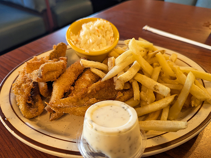 Lake Erie perch perfection—golden, crispy fillets that snap between your teeth, paired with fries that somehow stay crisp until the last bite.