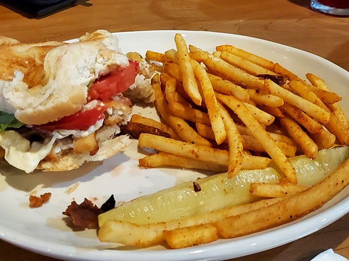 The legendary perch sandwich in all its glory – perfectly golden, impossibly fresh, and served with fries that deserve their own fan club.