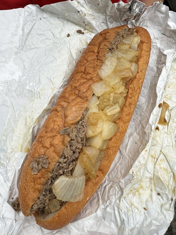 Behold the star of the show—finely chopped ribeye and caramelized onions nestled in a perfect roll. Poetry in sandwich form.