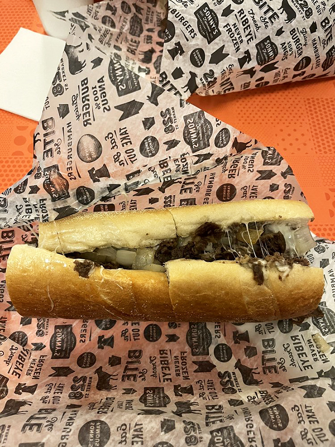 Behold the hero of our story—ribbons of beef embraced by melted cheese, all nestled in a roll that's somehow both sturdy and tender.