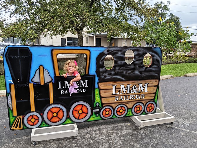 The LM&M Railroad's photo cutout provides the perfect family photo op – because nothing says "I had a great day" like pretending to be a tiny train conductor.
