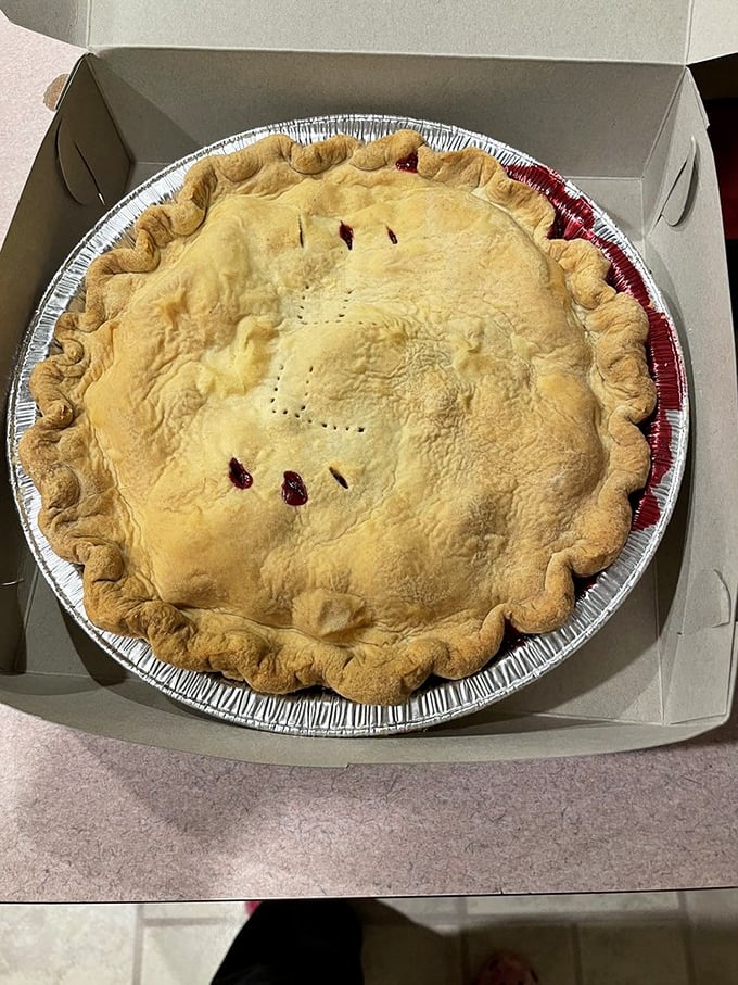 This isn't just pie – it's edible architecture with a golden-brown dome that whispers, "Take me home, and maybe don't tell anyone I'm here."