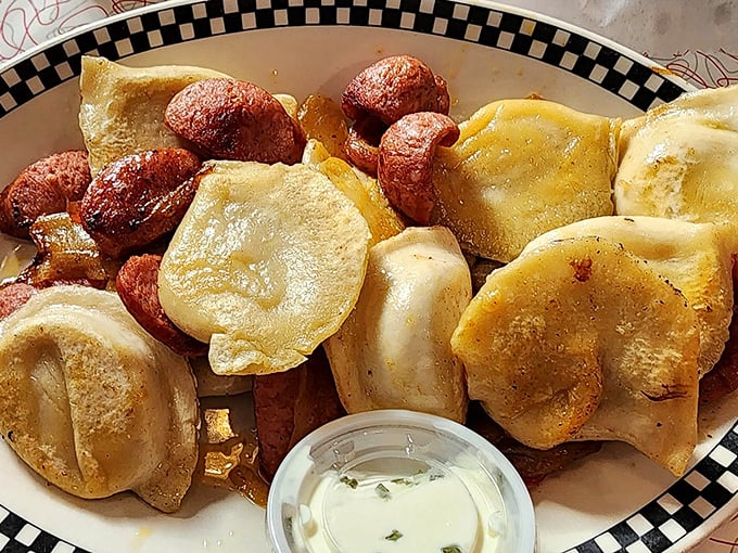 Golden-brown pierogies sharing a plate with kielbasa—a match made in heaven that would make your Eastern European ancestors weep with joy.