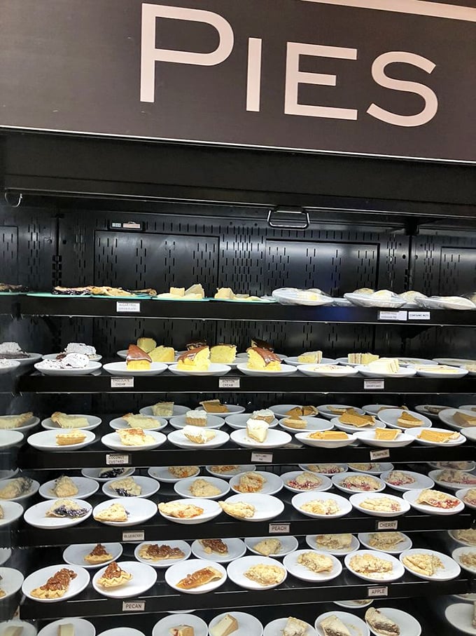 The pie display isn't just dessert—it's an art gallery where every masterpiece is meant to be destroyed with a fork.