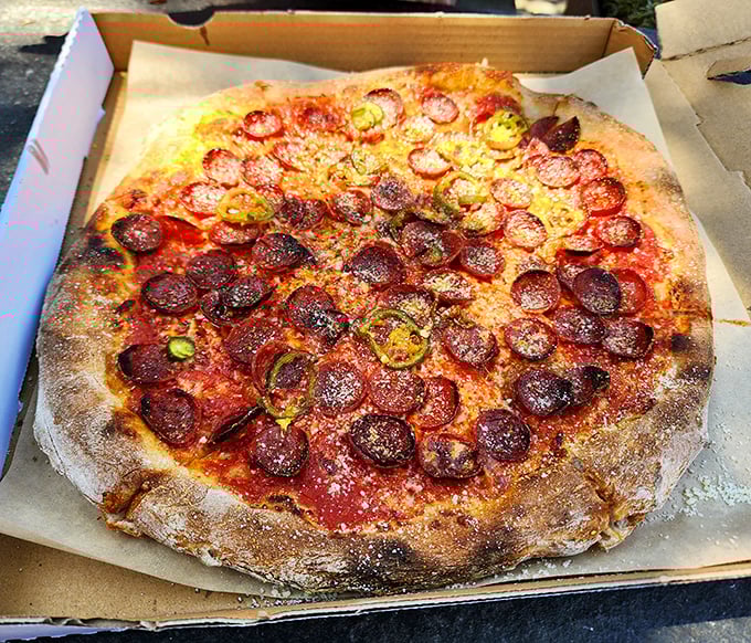 This isn't just pepperoni pizza—it's pepperoni that went to graduate school, with pickled jalapeños providing the perfect counterargument to richness.