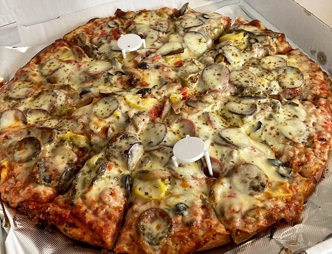 Behold "The Works" in all its glory – a pizza masterpiece that redefines what loaded really means.
