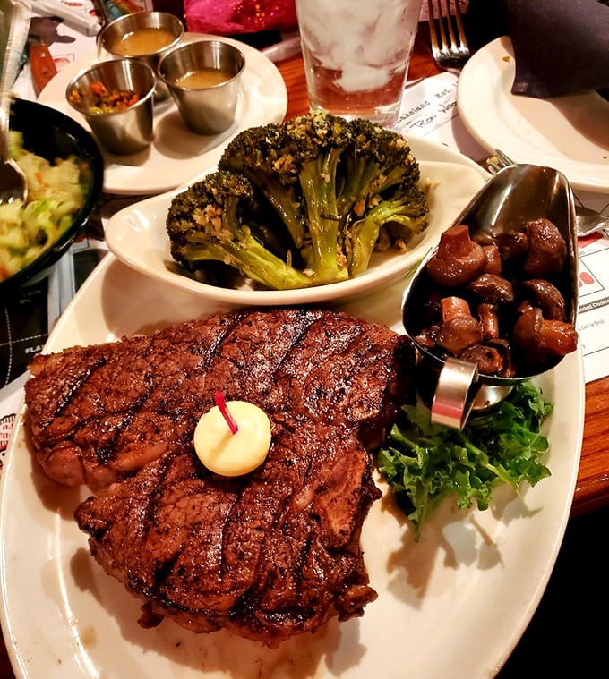 A steak that means business. The perfect char marks, a dollop of butter slowly melting, and sides that don't apologize for being delicious.