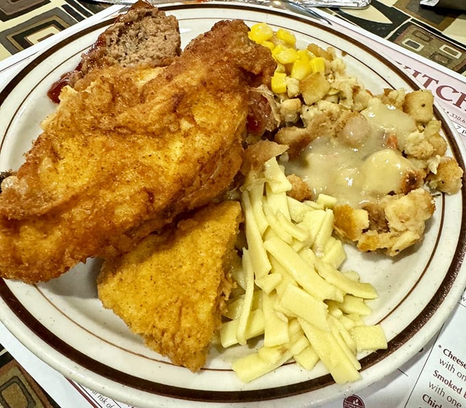 Golden fried chicken alongside creamy potatoes and buttery corn—proof that heaven might actually be a plate in Ohio.