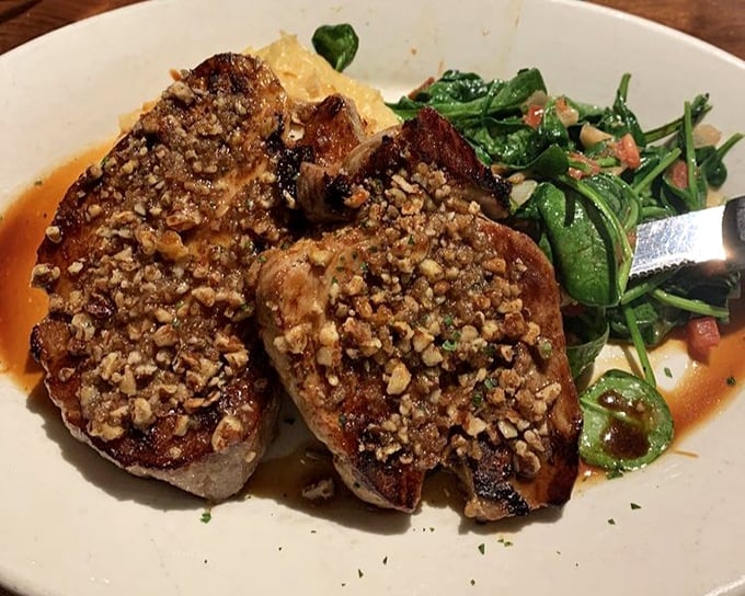 These pork chops aren't just cooked, they're transformed—crusted with nuts, perfectly seared, and paired with vibrant spinach that actually makes you want to eat your greens.