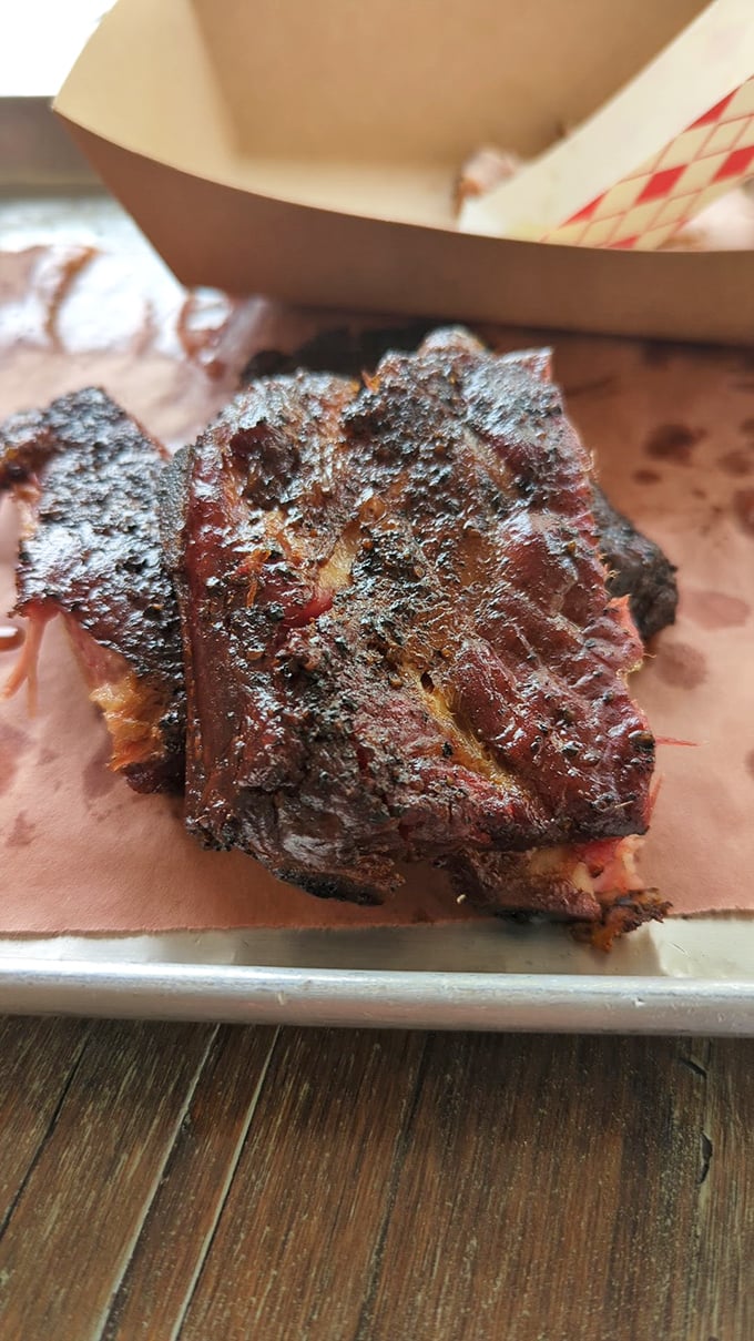 This isn't just a rib; it's a masterpiece of smoke and time with a bark so beautiful it deserves its own art exhibition.