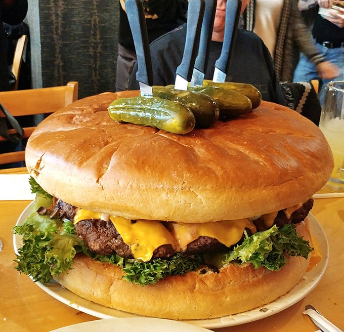 Not so much a burger as a skyscraper of beef with its own zip code. Those pickles aren't garnish – they're structural support.