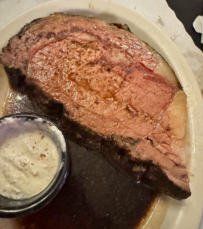 This prime rib isn't just dinner; it's a religious experience with horseradish cream sauce. The kind of beef that makes you question all other steaks you've ever eaten.