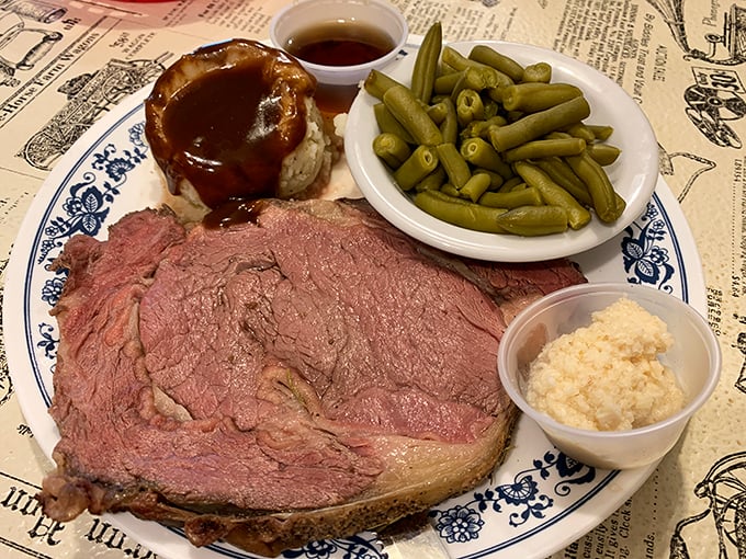 That prime rib arrives looking like it just won the meat lottery – perfectly pink and unapologetically enormous.