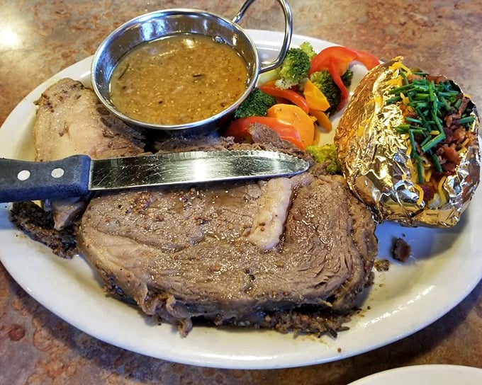 This prime rib arrives like a heavyweight champion – thick, juicy, and ready to knock you out.