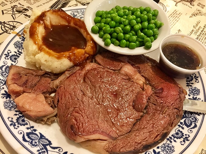 The legendary prime rib in all its glory—a masterpiece of meat that makes vegetarians question their life choices.