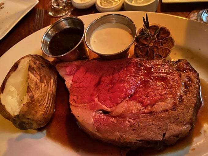 Behold the prime rib that launches a thousand road trips – perfectly pink, gloriously thick, and absolutely magnificent.