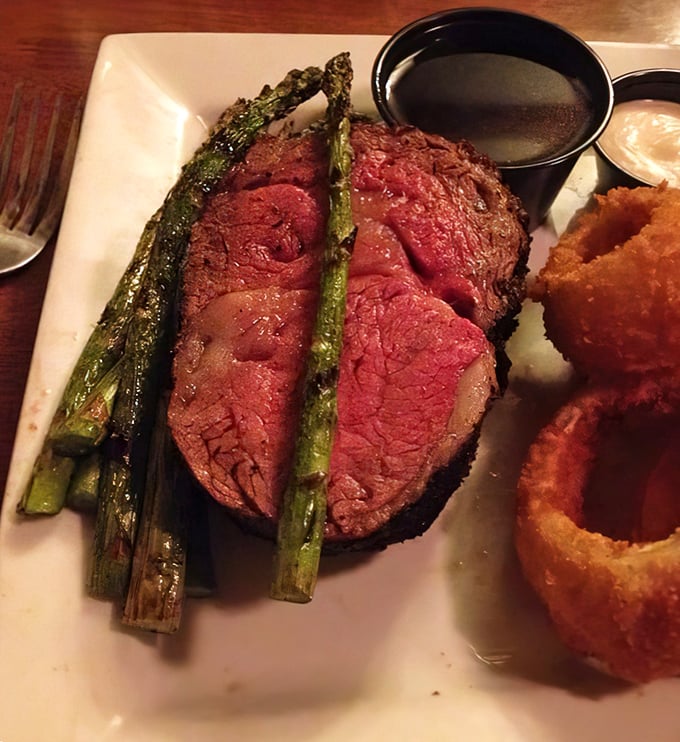 Prime rib so perfectly pink it could make a vegetarian weep. That au jus isn't a condiment—it's liquid gold.