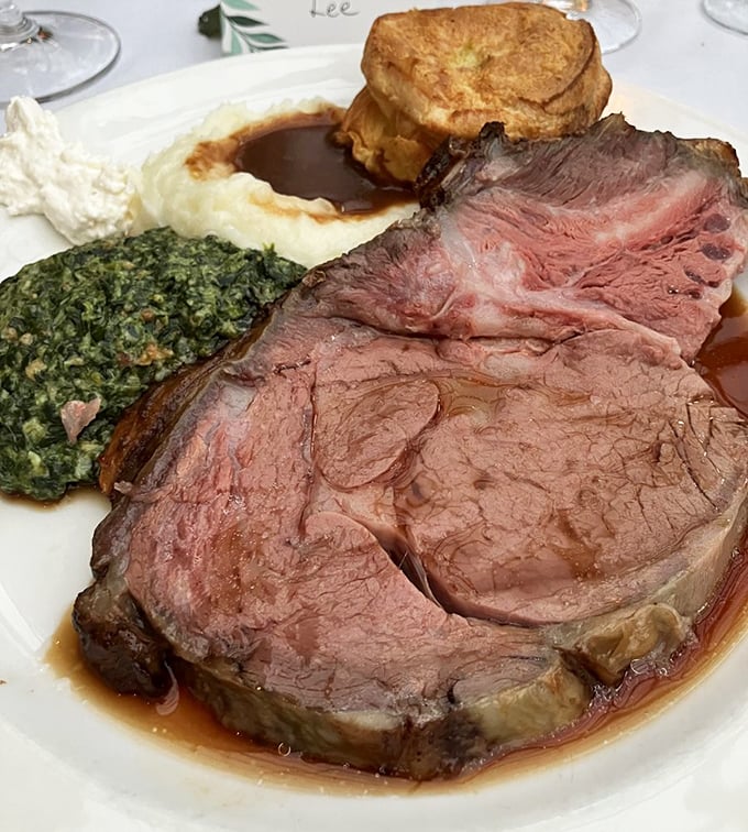 This isn't just prime rib—it's a masterpiece of meat, accompanied by its faithful sidekicks: Yorkshire pudding, creamed spinach, and au jus.